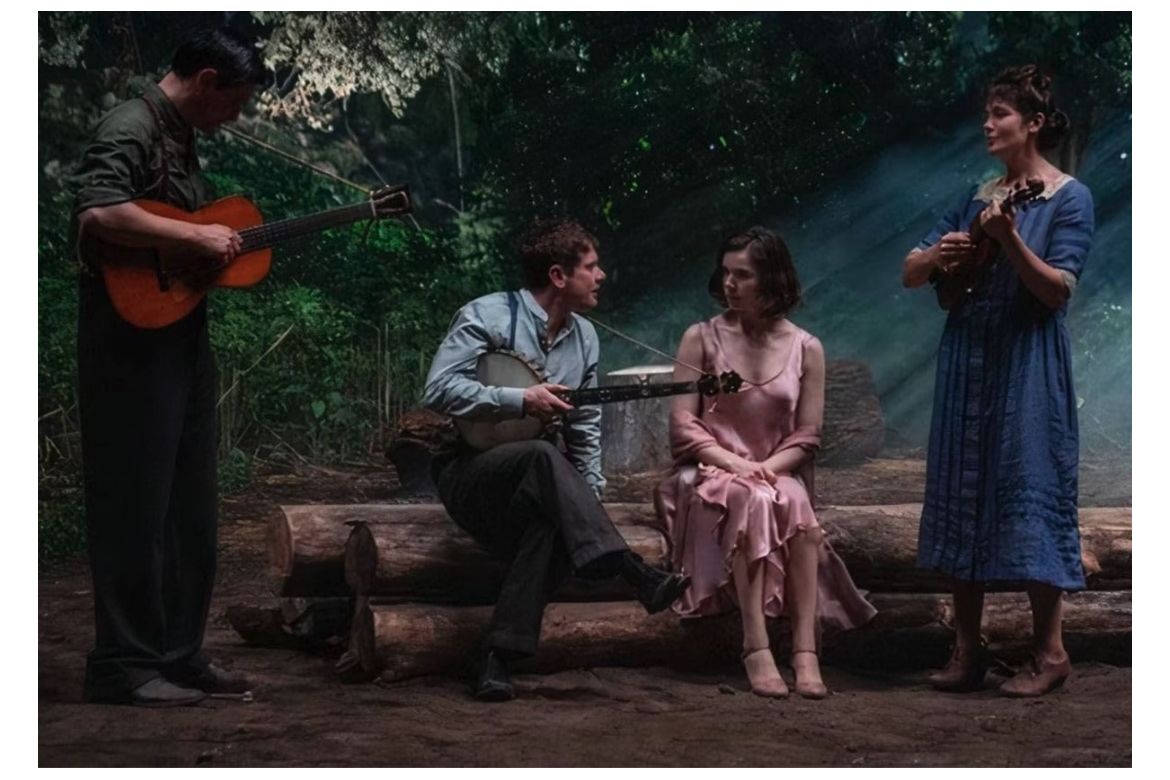 Photo | The vampire leader Remmick and his followers sit on a log ...