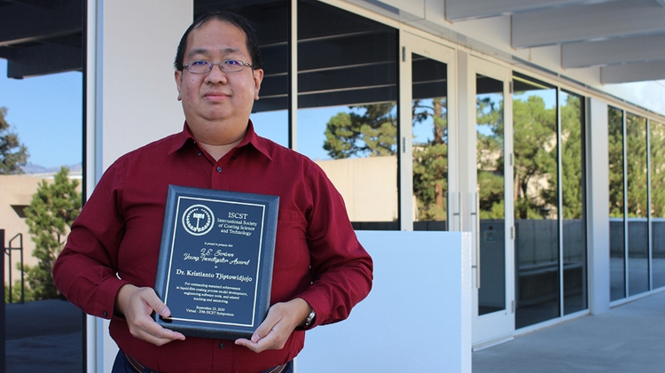 Engineering professor presents research and receives award during ...