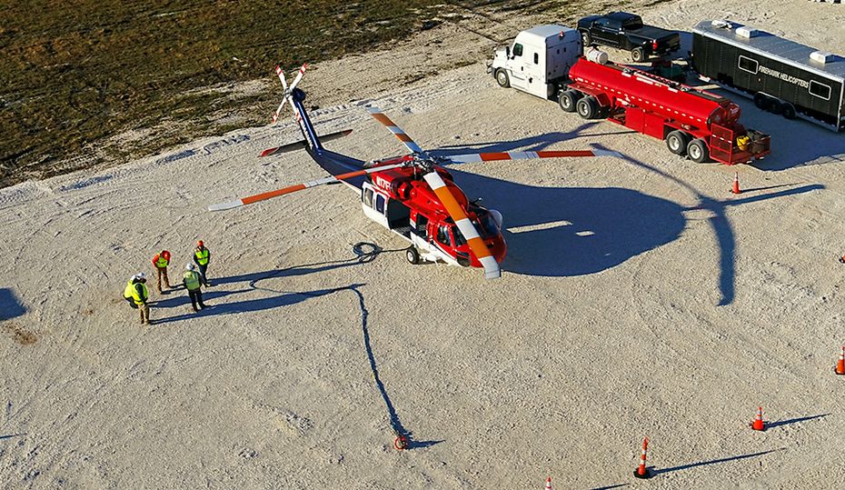 Helicopters replace massive transmission lines toppled by Hurricane ...