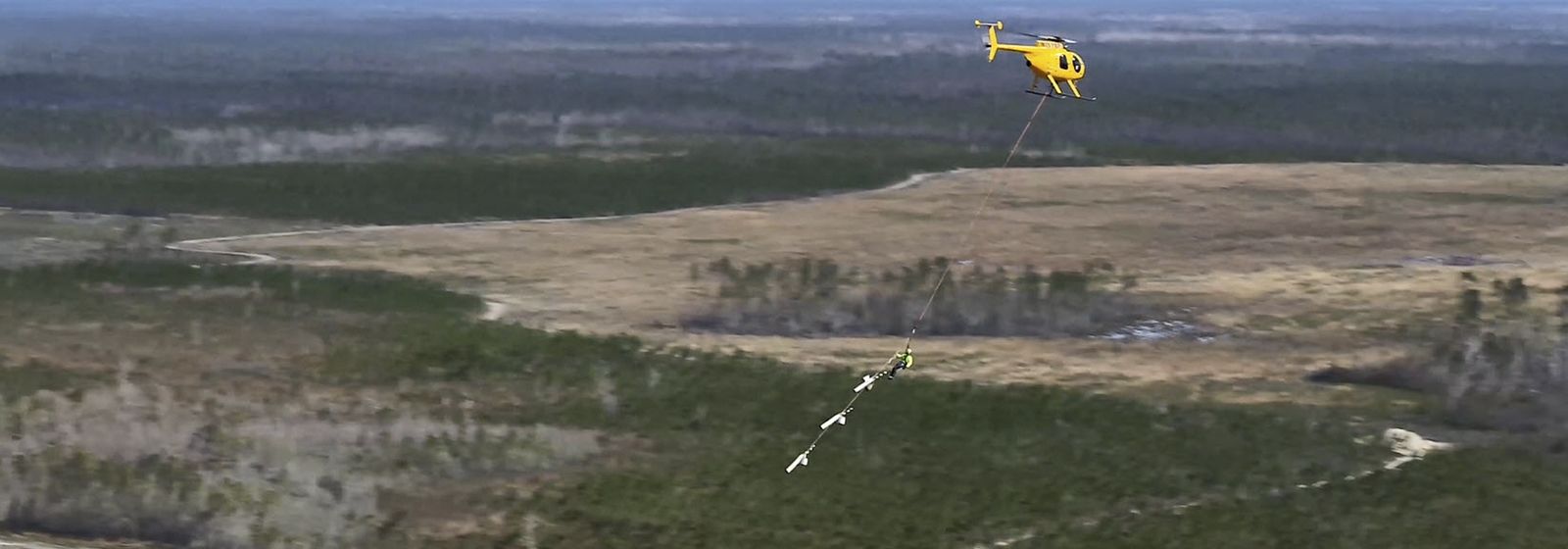Helicopters replace massive transmission lines toppled by Hurricane ...