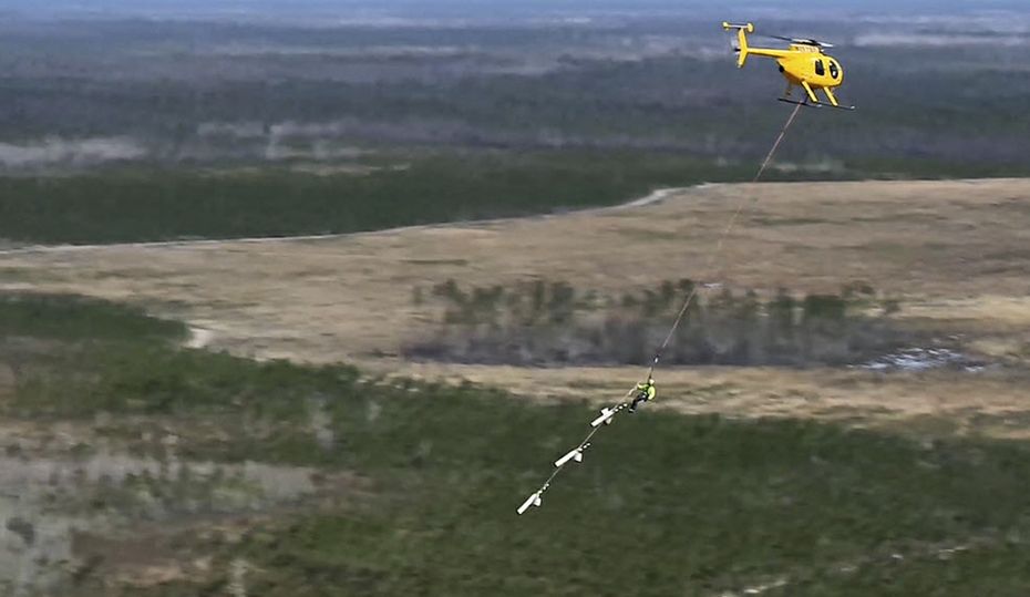 Helicopters replace massive transmission lines toppled by Hurricane ...