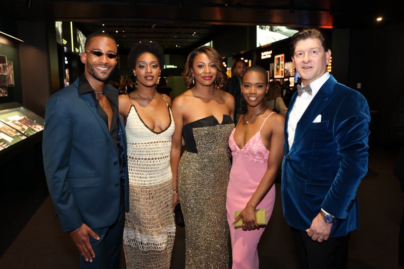 Co-Chairs Sela Thompson Collins and Lyndon Boozer with Ailey Company ...