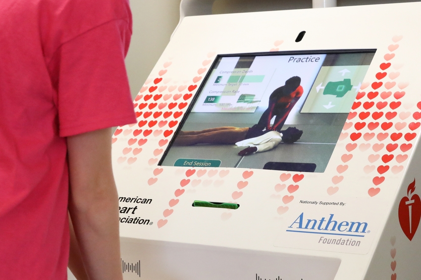 Photo | Girl following CPR video | American Heart Association