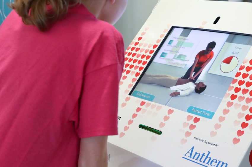 Photo | Girl practicing CPR (V) | American Heart Association