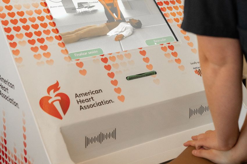 Photo | Firefighter demonstrating Hands-Only CPR at kiosk | American ...