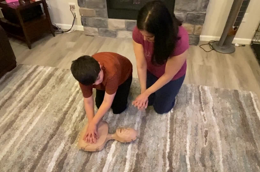 Video | Parents showing children CPR techniques b-roll | American Heart ...