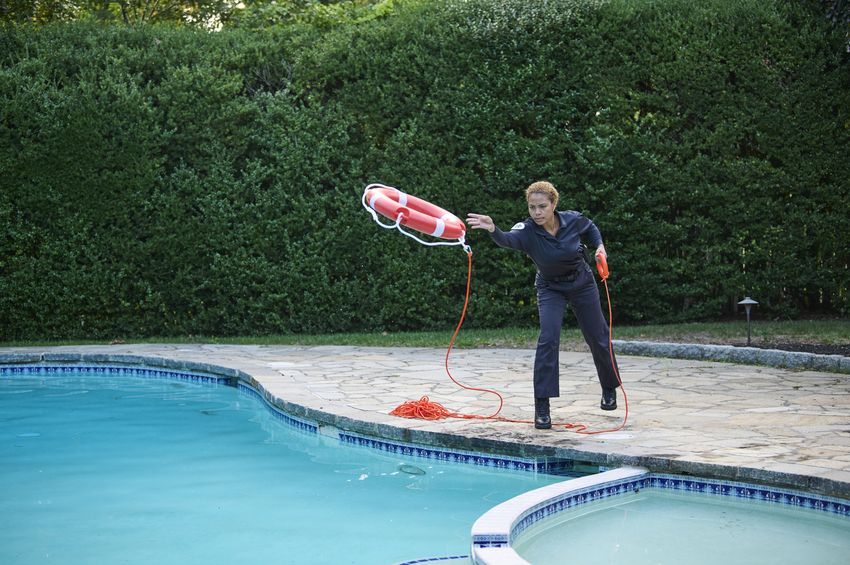 Photo | Paramedic throwing floatation device | American Heart Association