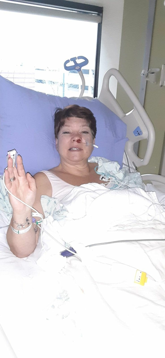 Photo | Shelly waves from hospital bed | American Heart Association