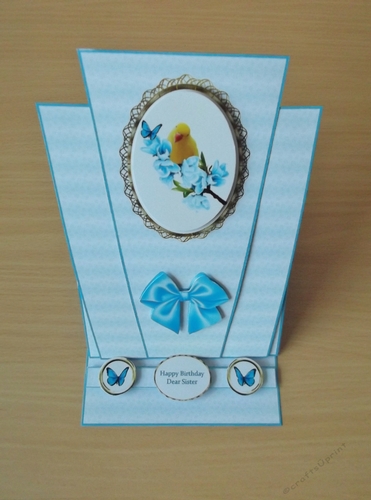 Canary triangle easel card in blue. - CUP845302_20842 | Craftsuprint