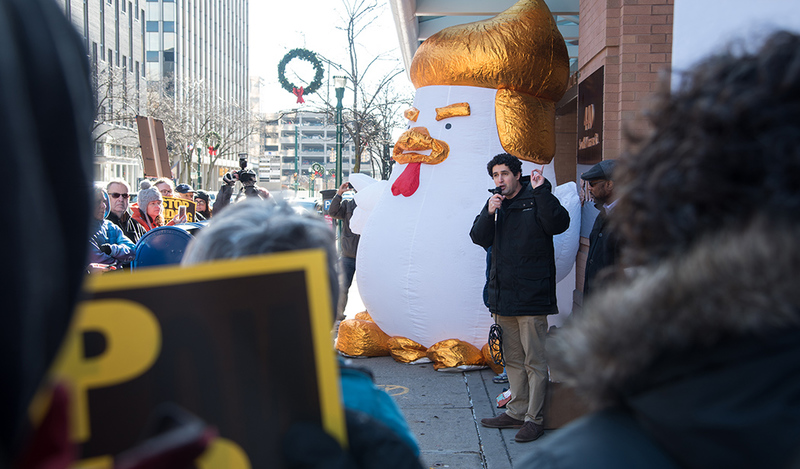 Protesters rally outside Rep. Katko’s office, bringing along a giant ...