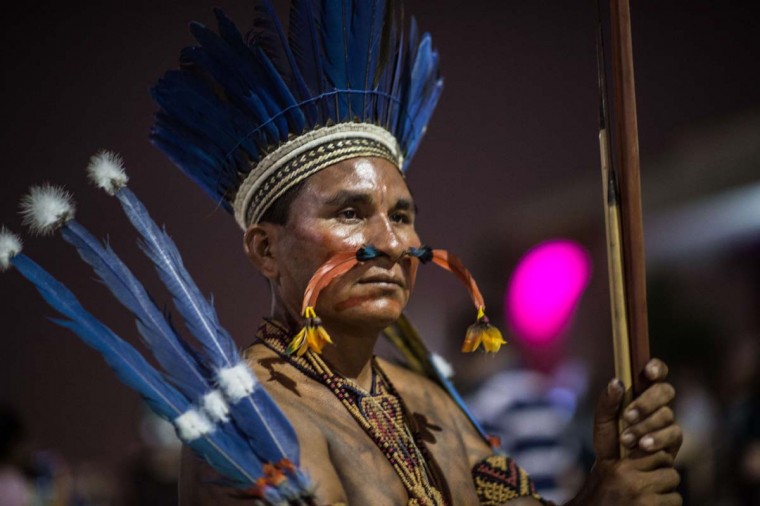 TOPSHOTS A Brazilian indigenous man attends a ceremony on the eve of ...