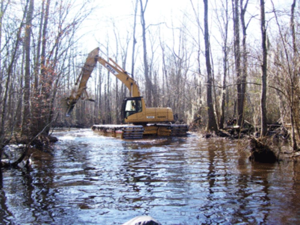 Floating Excavator Vital in Swamp Restoration Project :: Story ID ...