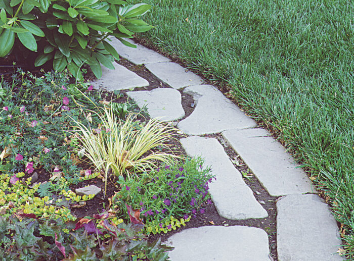 Tumbled Stone Edging Front Lawn