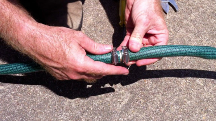 Clever storage for coiled hoses - Fine Gardening