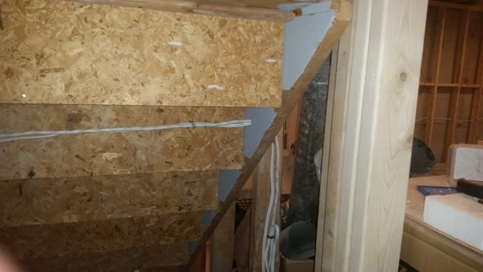 Electrician drilled holes in stair stringer - Fine Homebuilding
