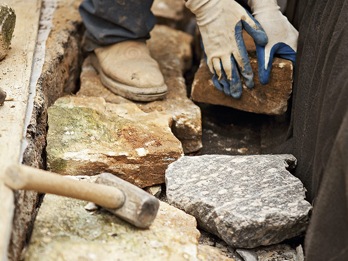 Setting the Footing for a Dry-Stack Retaining Wall - Fine Homebuilding