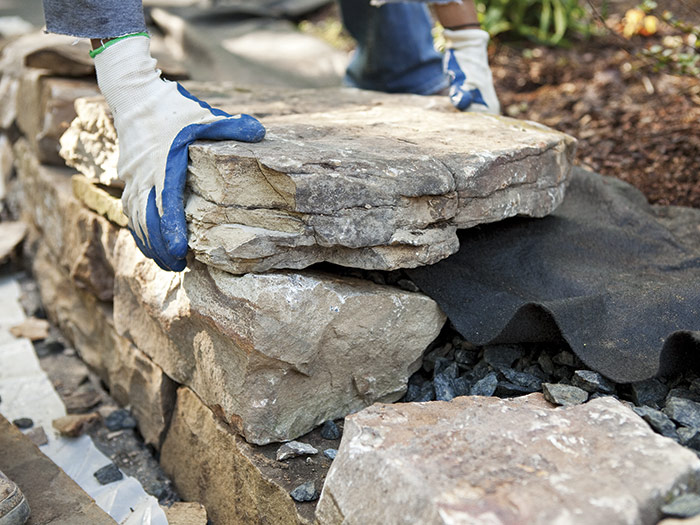 Setting the Stones for a Dry-Stack Retaining Wall - Fine Homebuilding