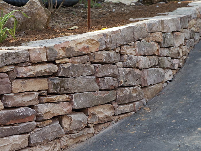 Setting the Stones for a Dry-Stack Retaining Wall - Fine Homebuilding