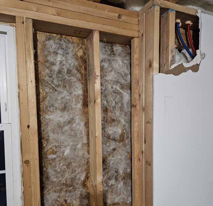Unfinished laundry room, frost in stud bays behind insulation - Fine ...