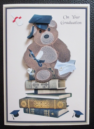 Graduation card with teddy, books, mortar board and certificate ...