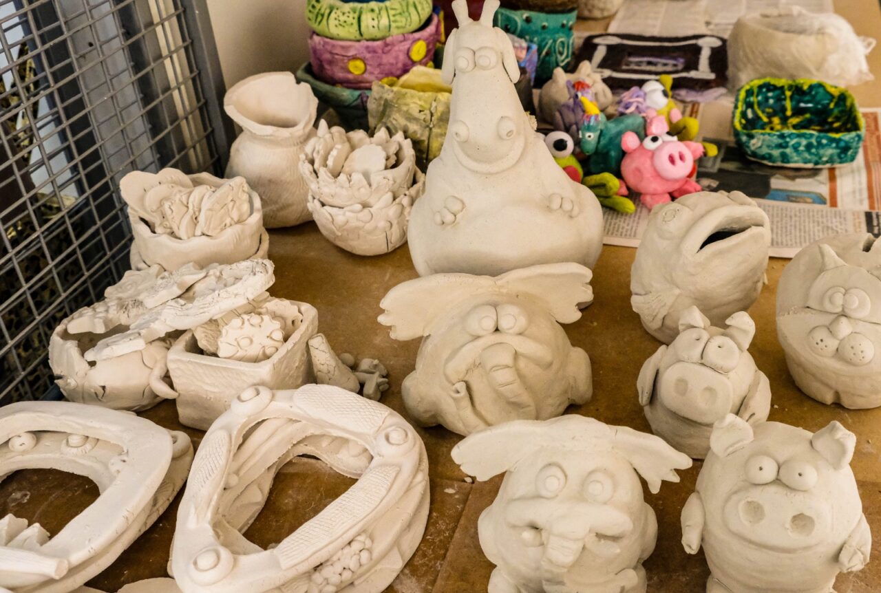 Children learn to create clay artwork in summer lessons