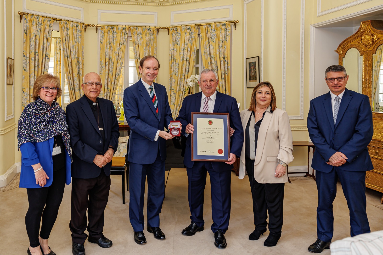 Clive Nuza presented with Governor’s Award for Merit