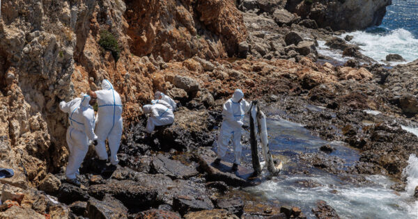 Oil spill responders work tirelessly to clean up Rosia Bay