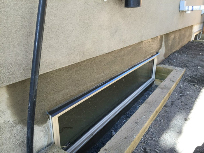 How is head flashing done with parge coating around basement windows ...