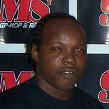 John F. Davis, age 48