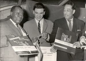 Louis Armstrong, Rene Urtregger, and Duke Ellington receiving the ...