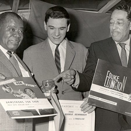 Louis Armstrong, Rene Urtregger, and Duke Ellington receiving the ...