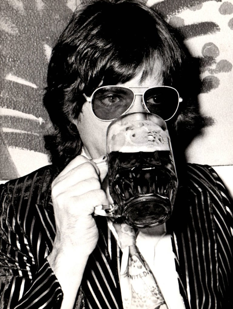 Mick Jagger drinking beer from a mug in Germany - Holden Luntz Gallery