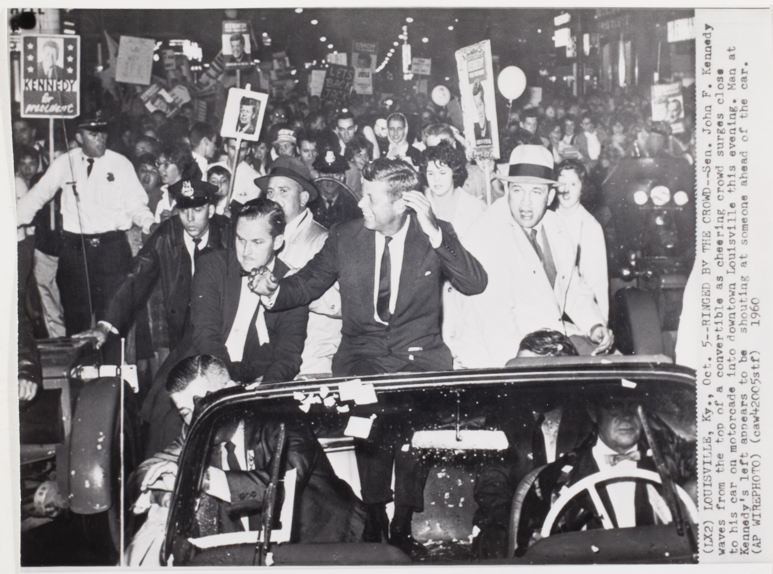 [John F. Kennedy waving to crowd from motorcade, Louisville, Kentucky ...