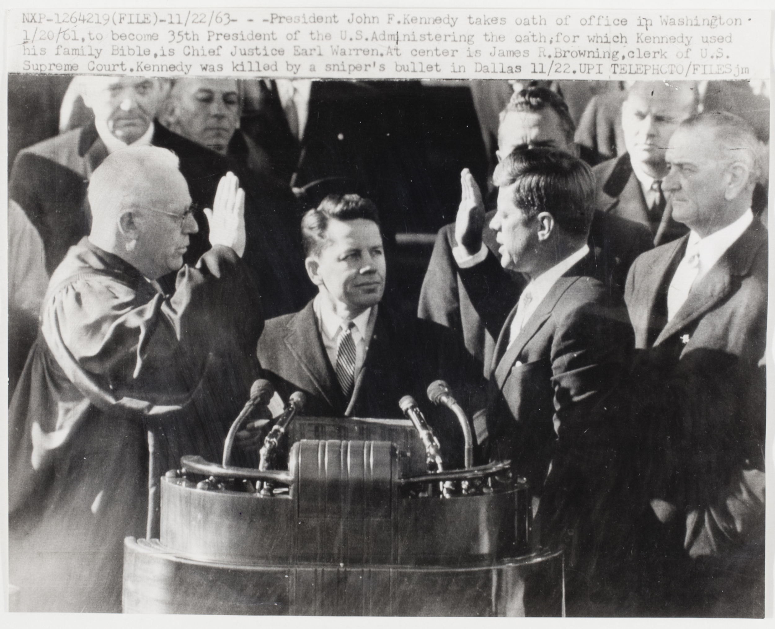 [John F. Kennedy taking presidential oath of office under Earl Warren ...