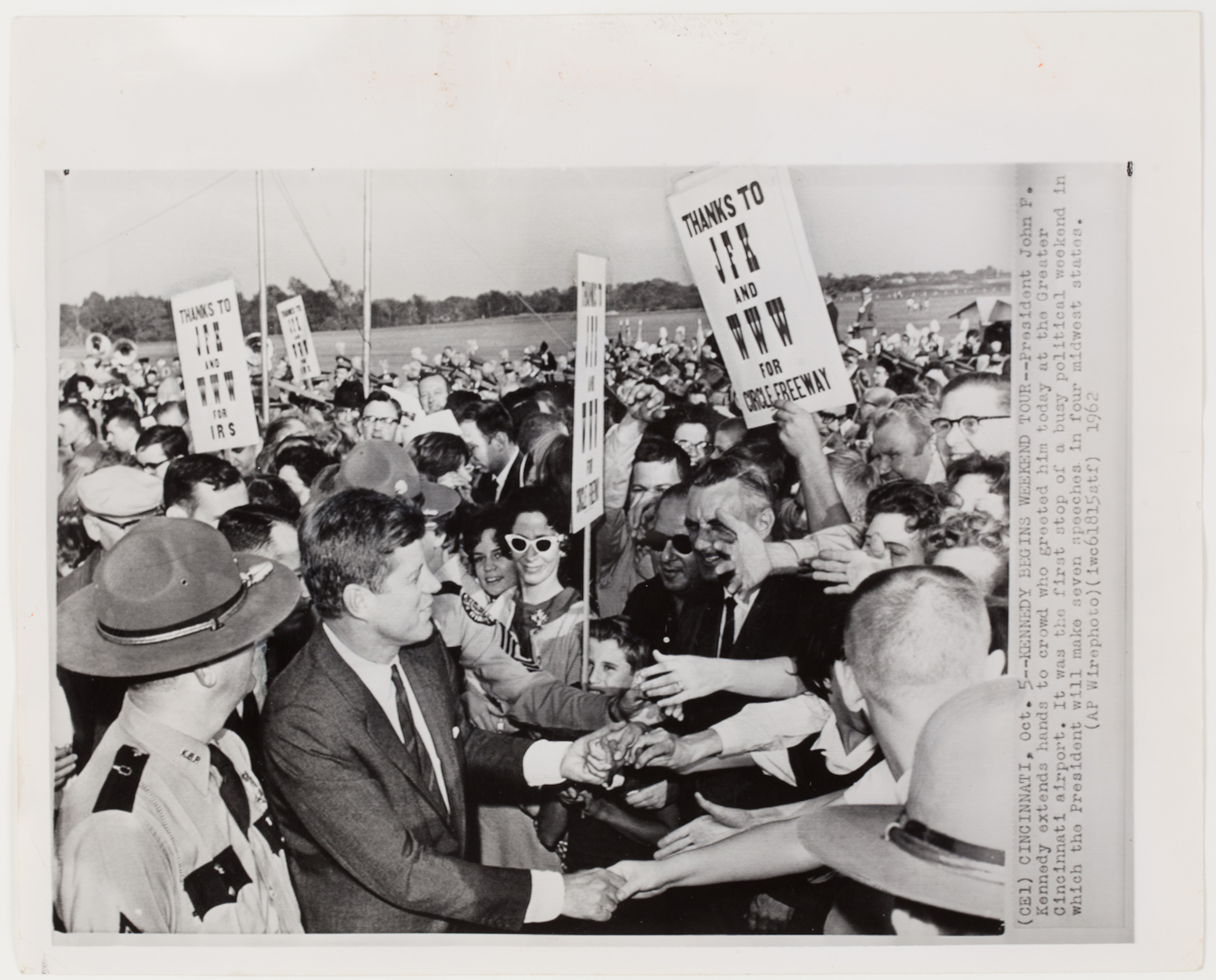 [President John F. Kennedy shaking hands with the crowd outside the ...