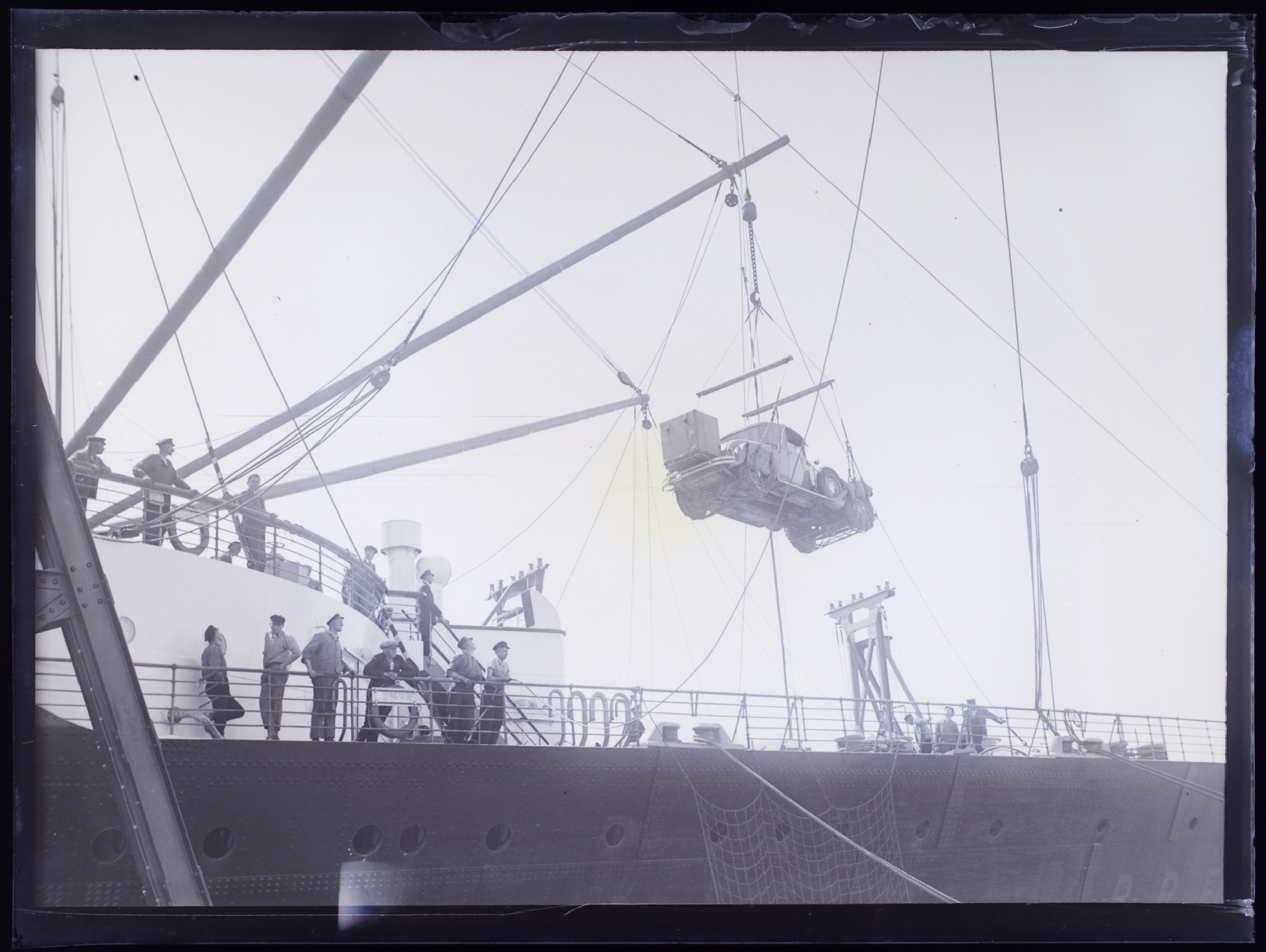 [Car being lowered onto deck of SS Bremen, Bremerhaven, Germany ...