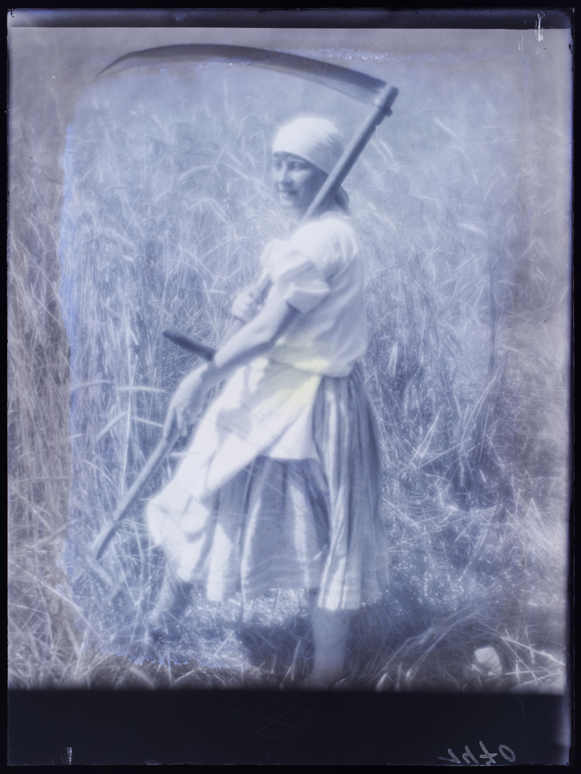 [Woman holding scythe] | International Center of Photography