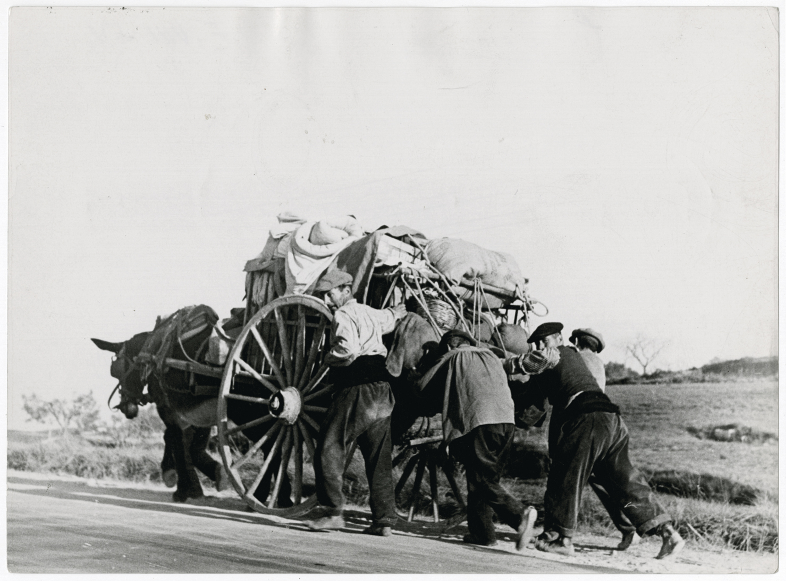 [Refugees push a mule-cart uphill, outside Barcelona] | International ...