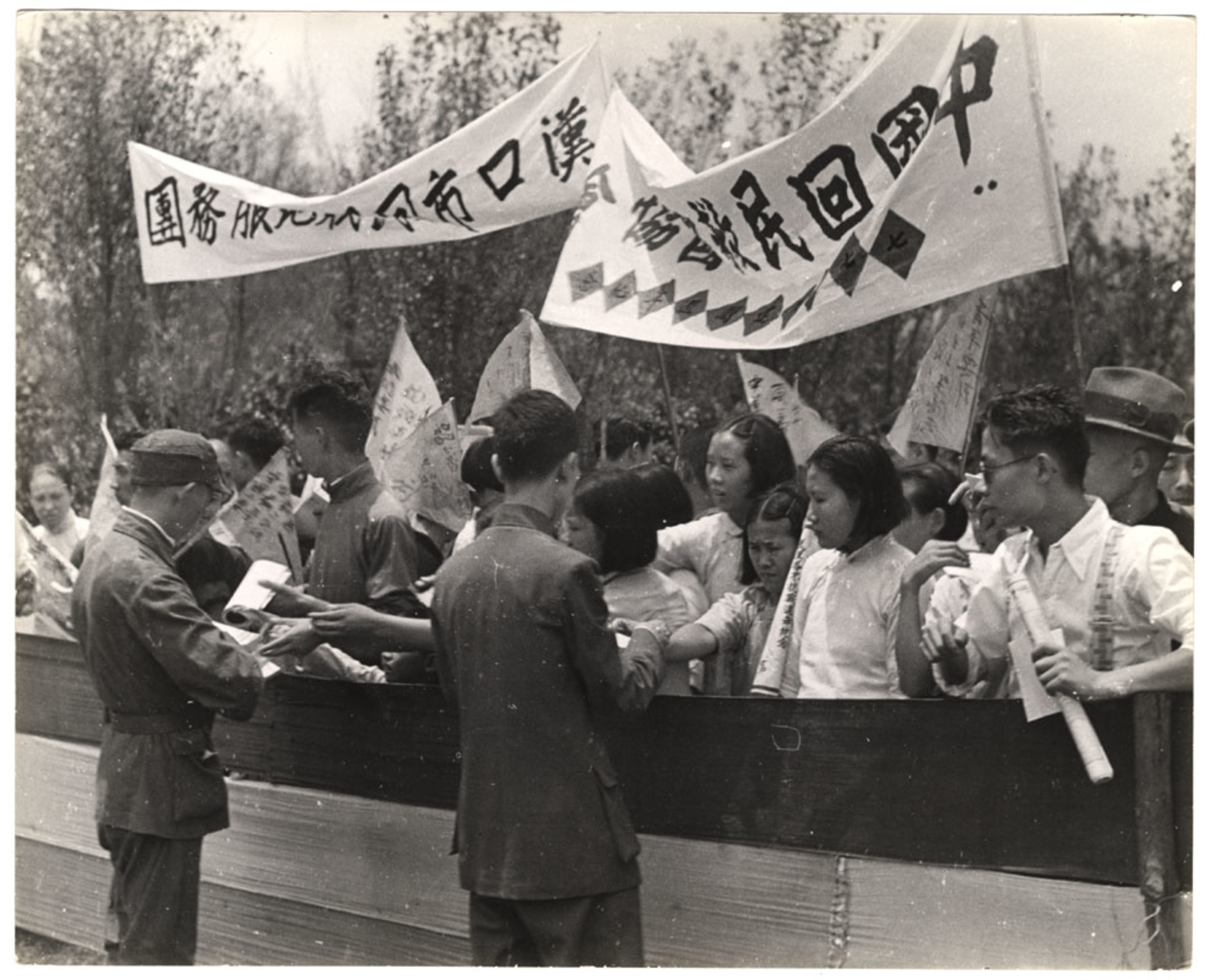 [Distribution of leaflets at the parade for the 1st Anniversary of War ...