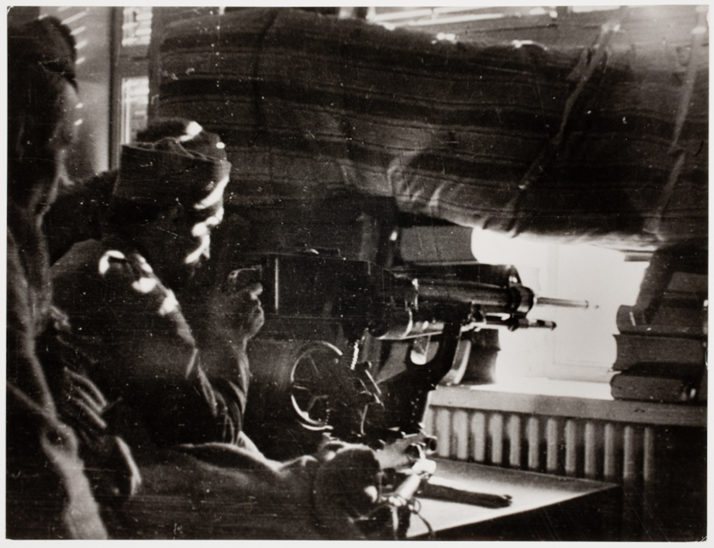 [Republican soldier aiming his rifle through a window, University City ...