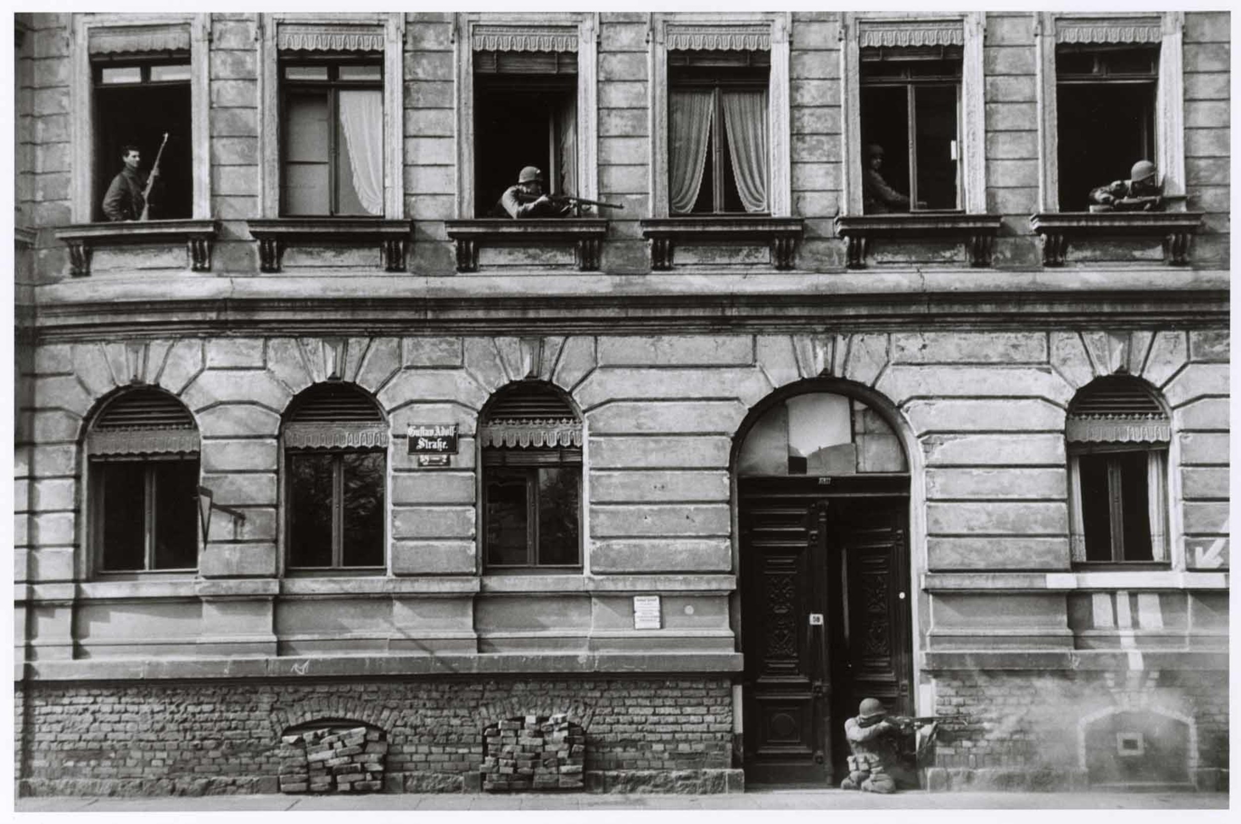 [American soldiers shooting from an apartment building on Gustav-Adolf ...