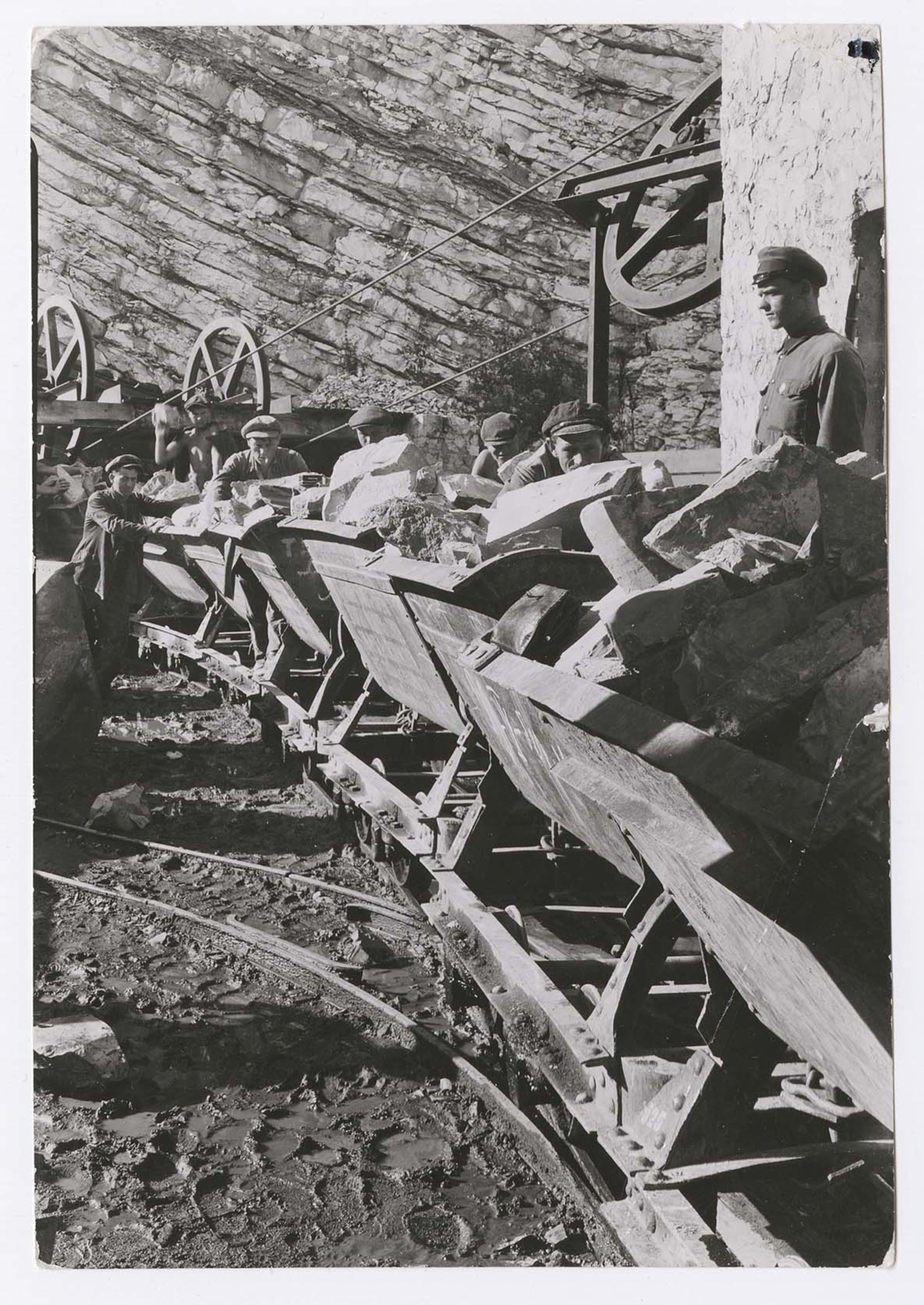 Russian workmen with hoppers of rock for making cement | International ...