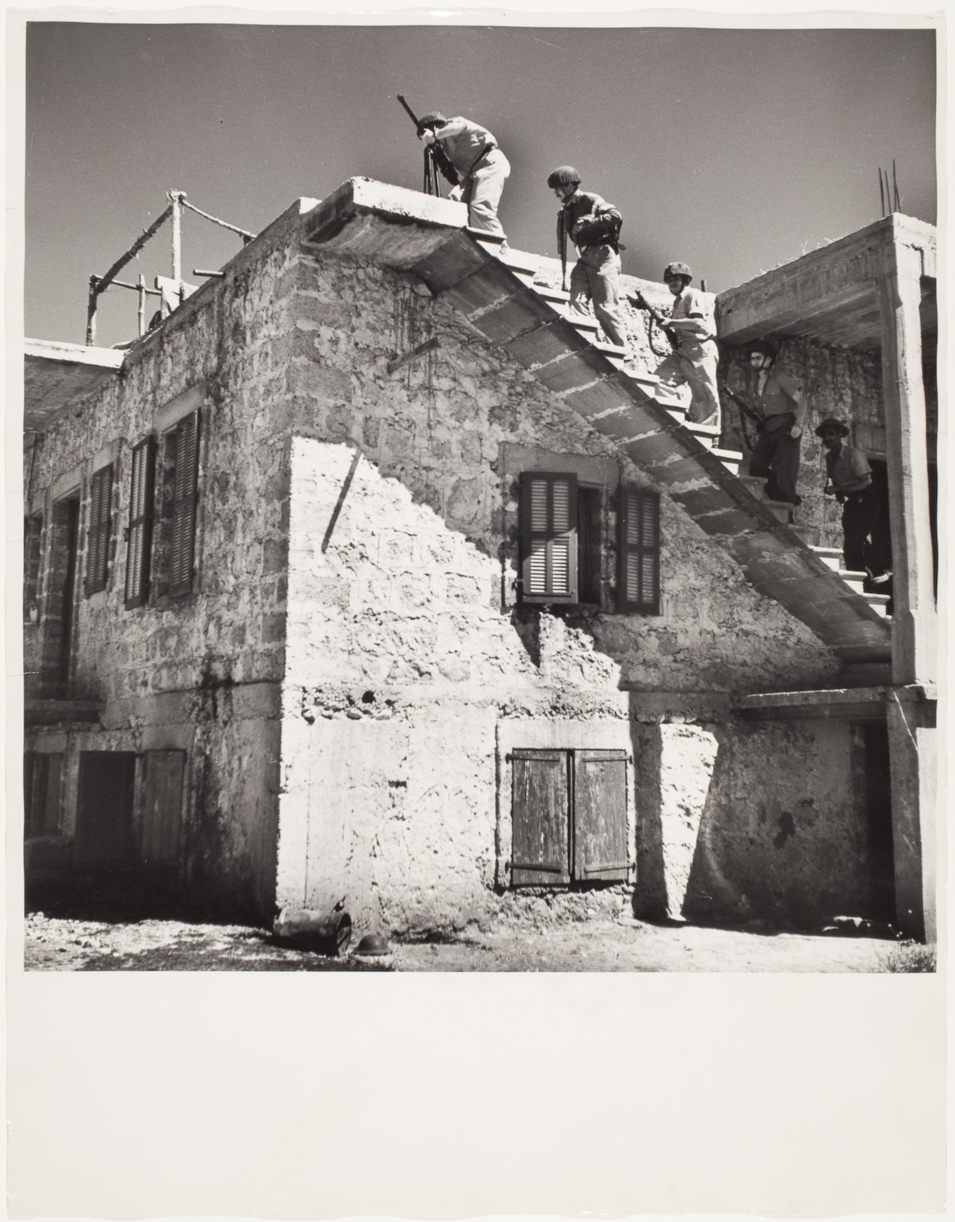 [Soldiers walking up stairs, Israel] | International Center of Photography
