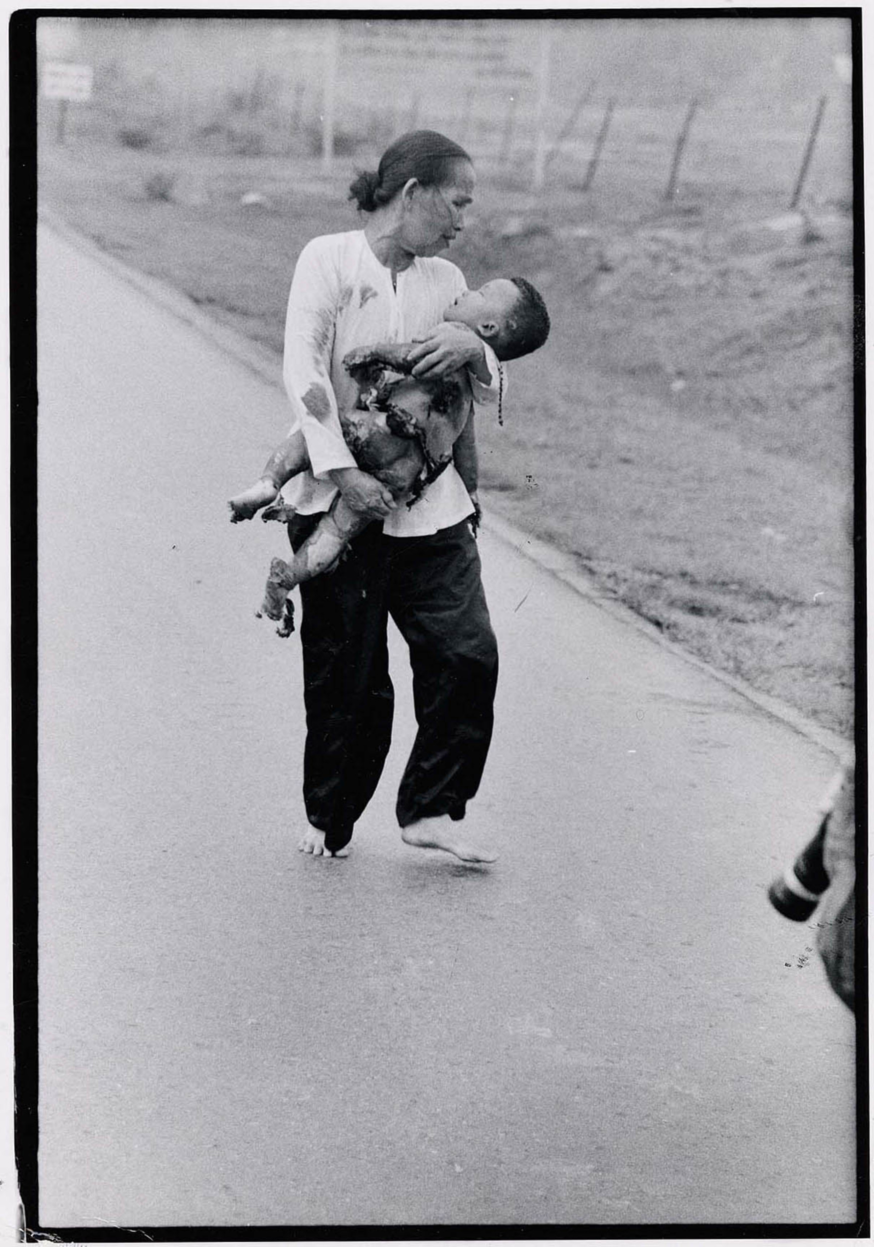 Fatally burned child in mother's arms after load of napalm canisters ...