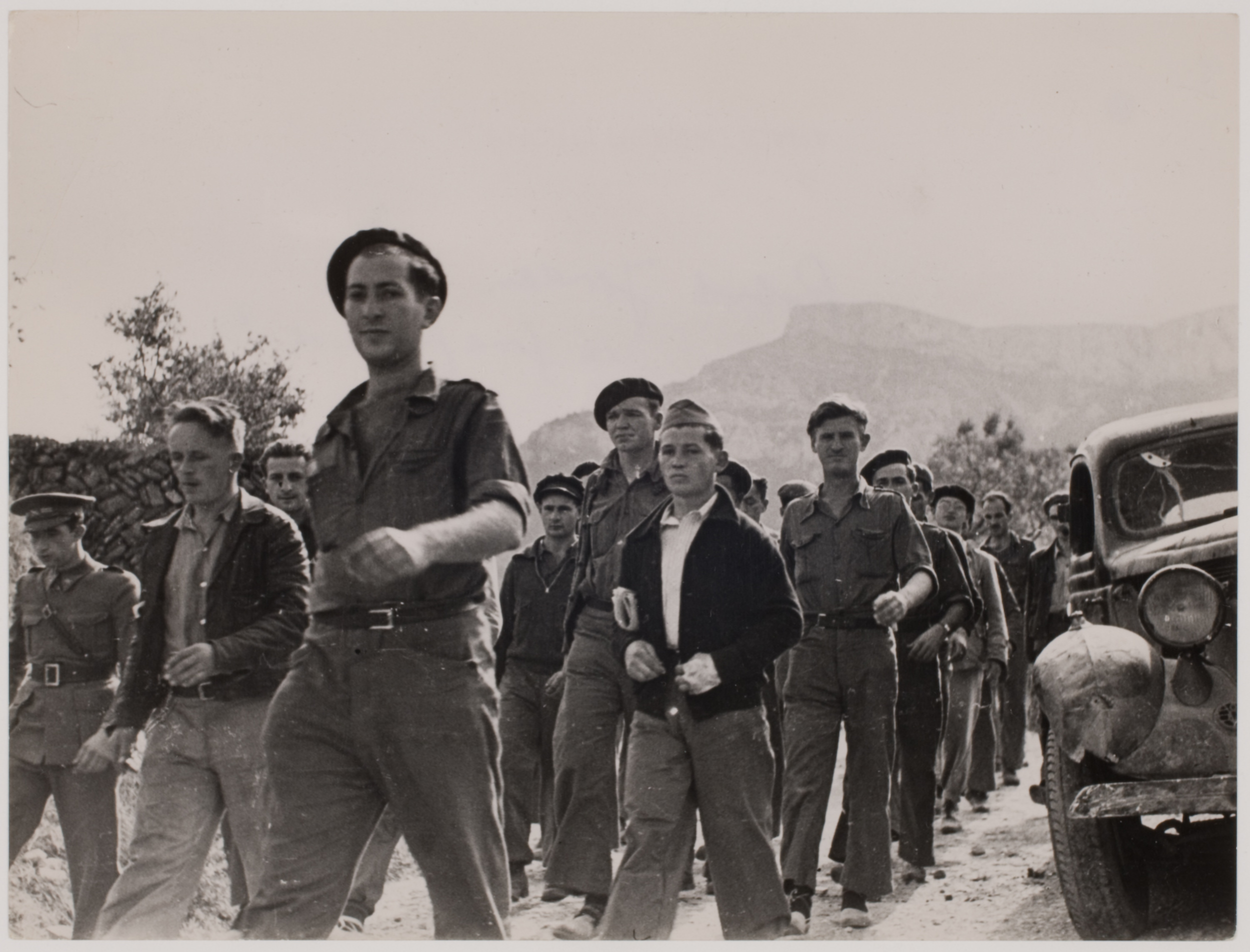[Marching soldiers, including Robert Jordan, in farewell ceremony for ...