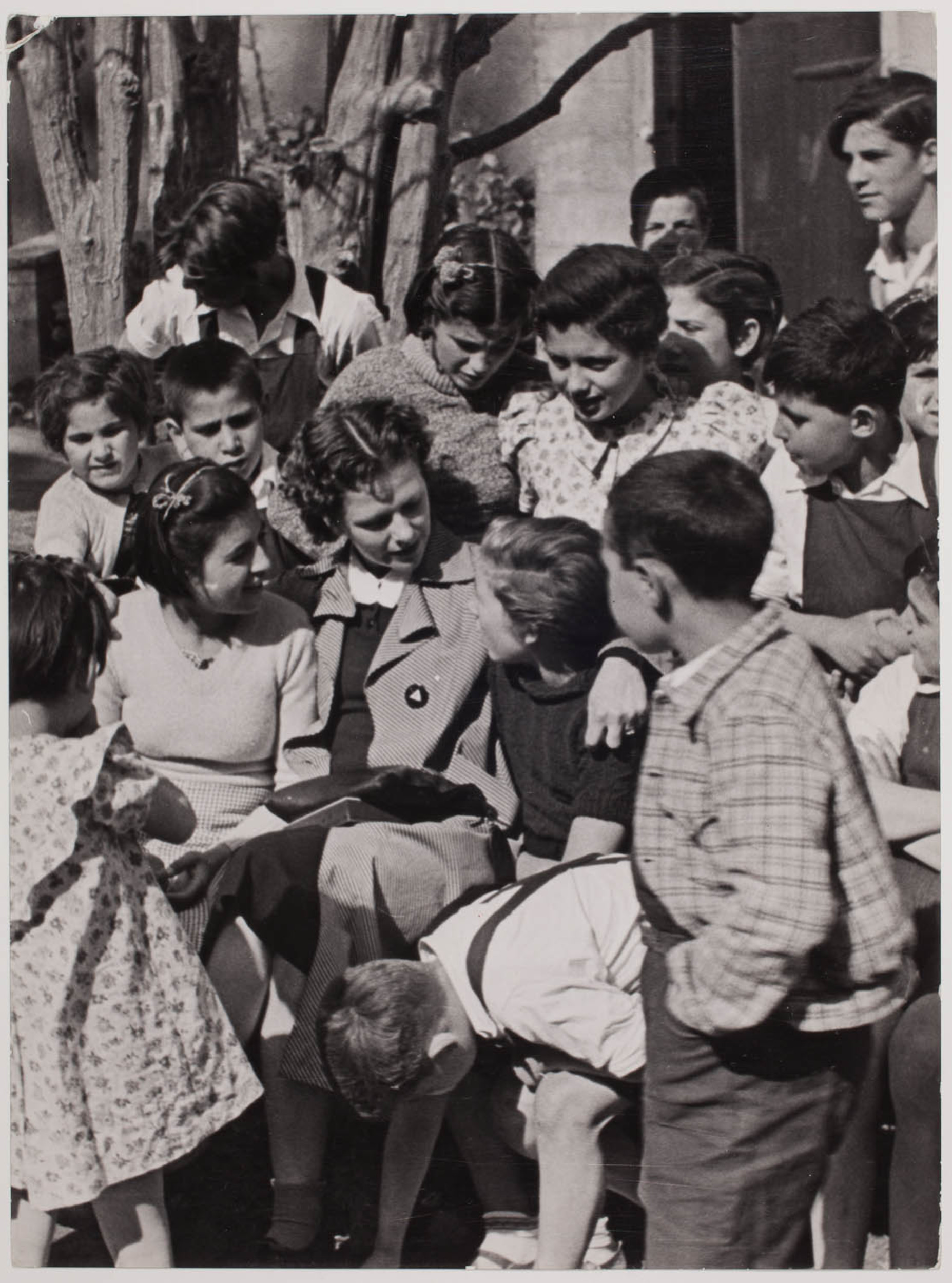 [Children crowding around Esme Odgers at a home for Spanish refugee ...