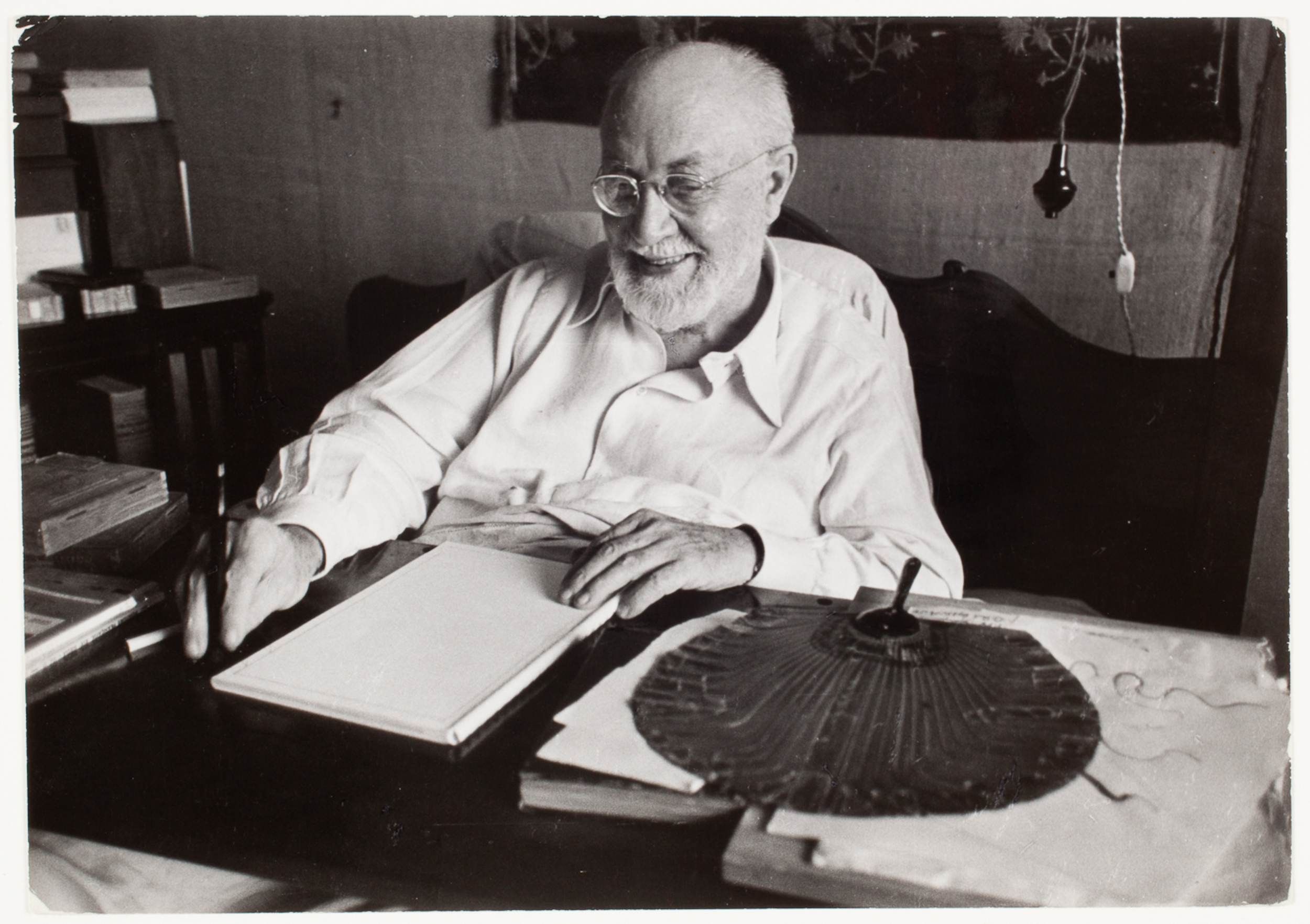 [Henri Matisse smiling and working from his bed at the Hotel Regina in ...