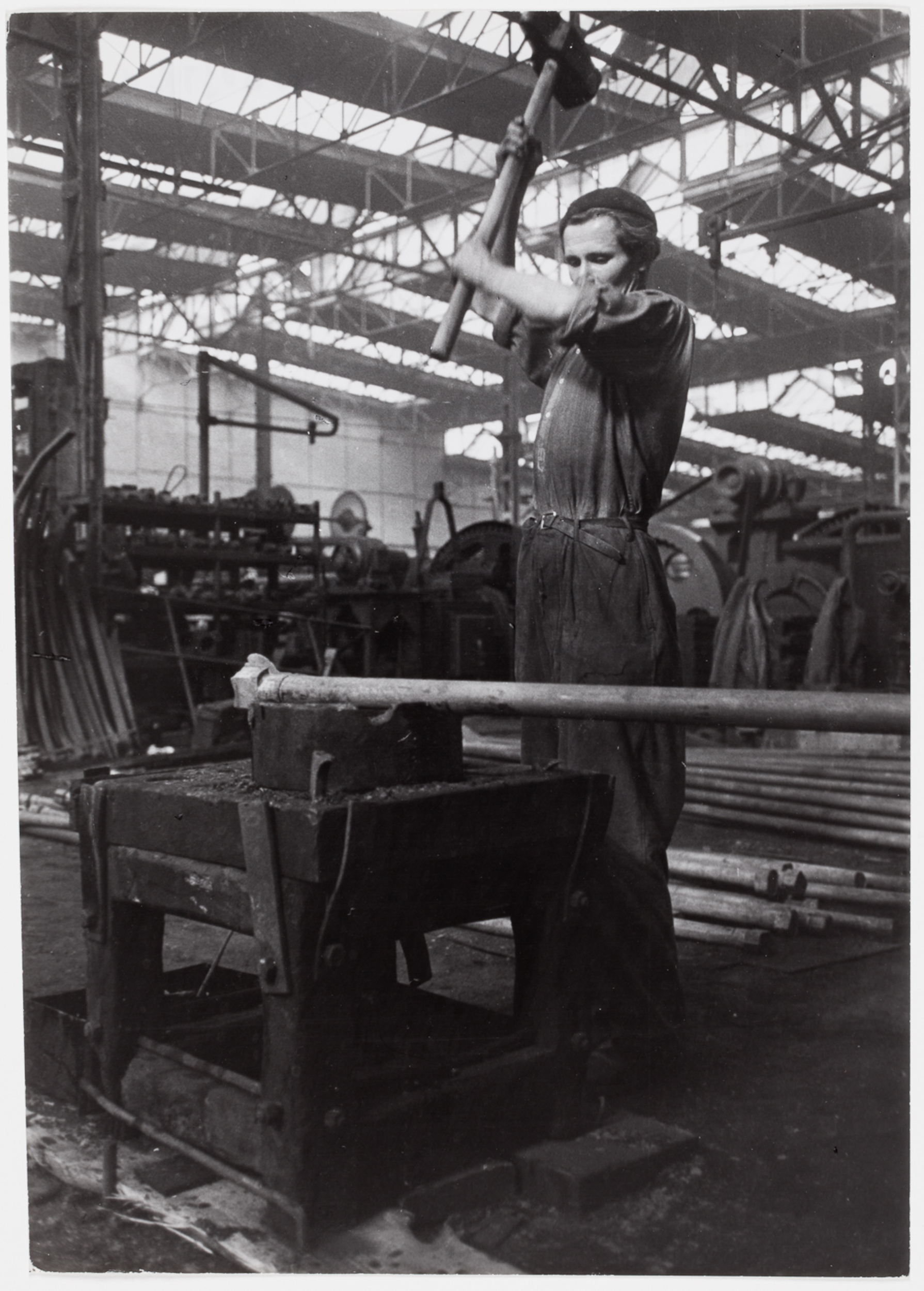 [Worker with hammer in railroad car factory, Wroclaw, Poland ...