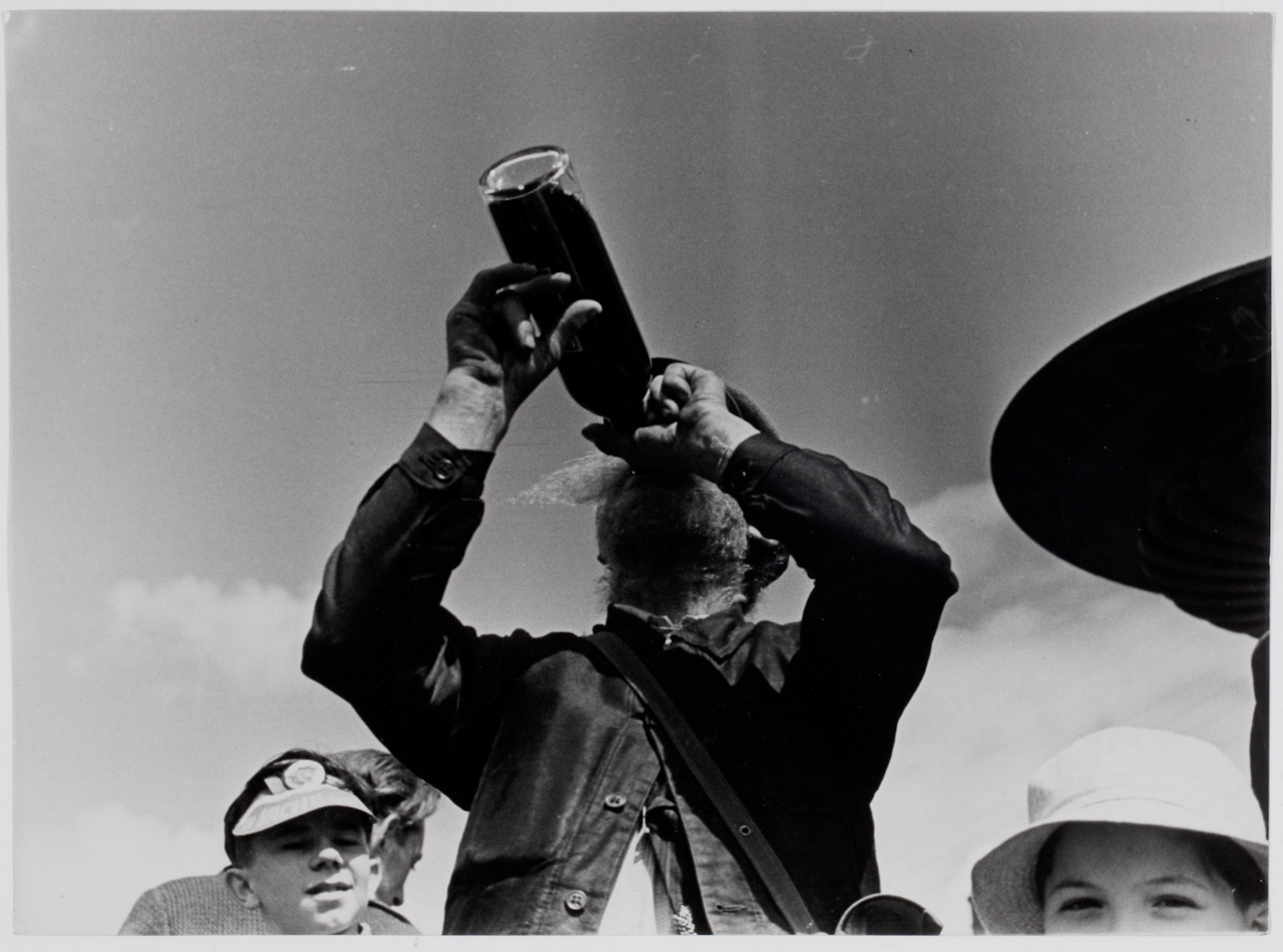 [Man drinking from wine bottle, Tour de France, Pleyben, France ...
