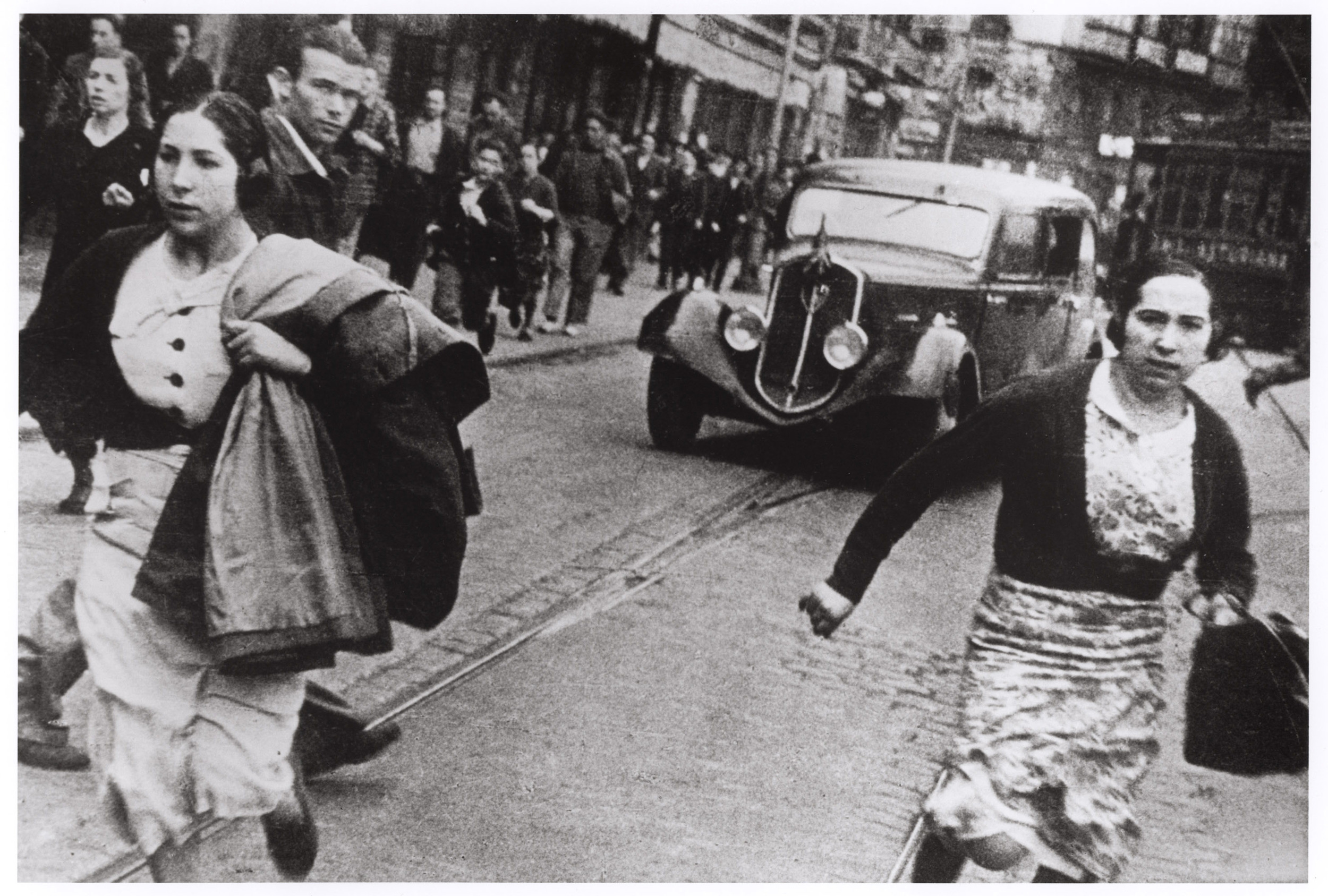 [Civilians running in the street during air raid siren, Bilbao, Spain ...
